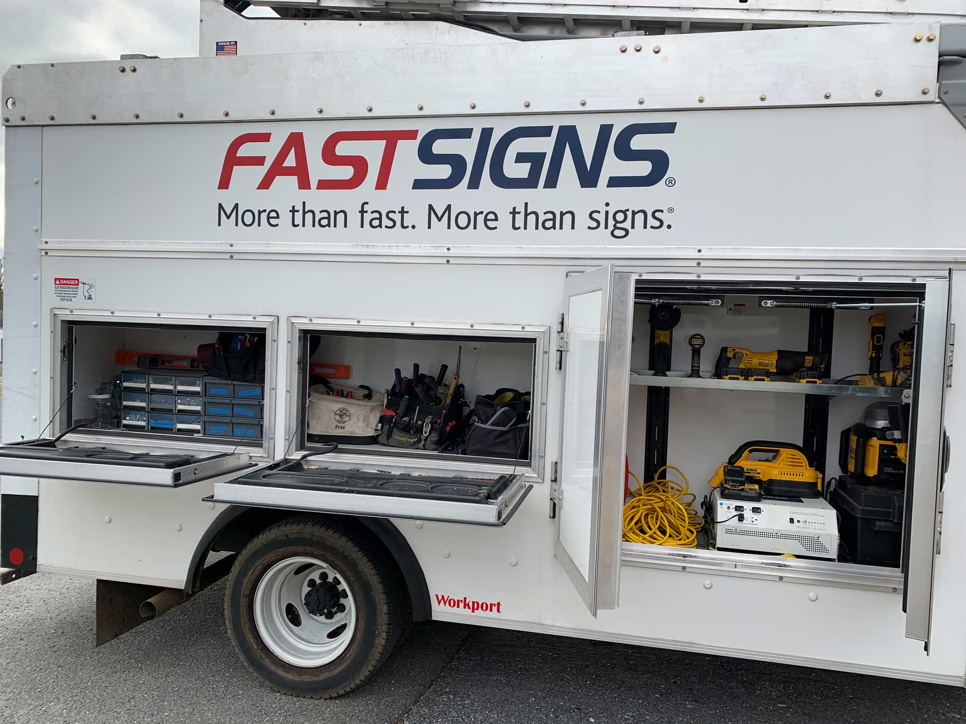 An Installation Center with a Lift on Top - Van Ladder Bucket Trucks